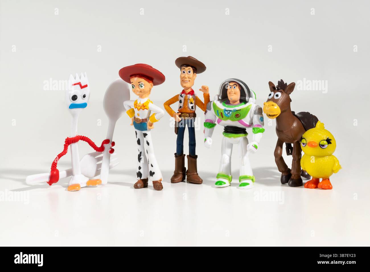 Toy Story figurines standing on white background, representing popular ...