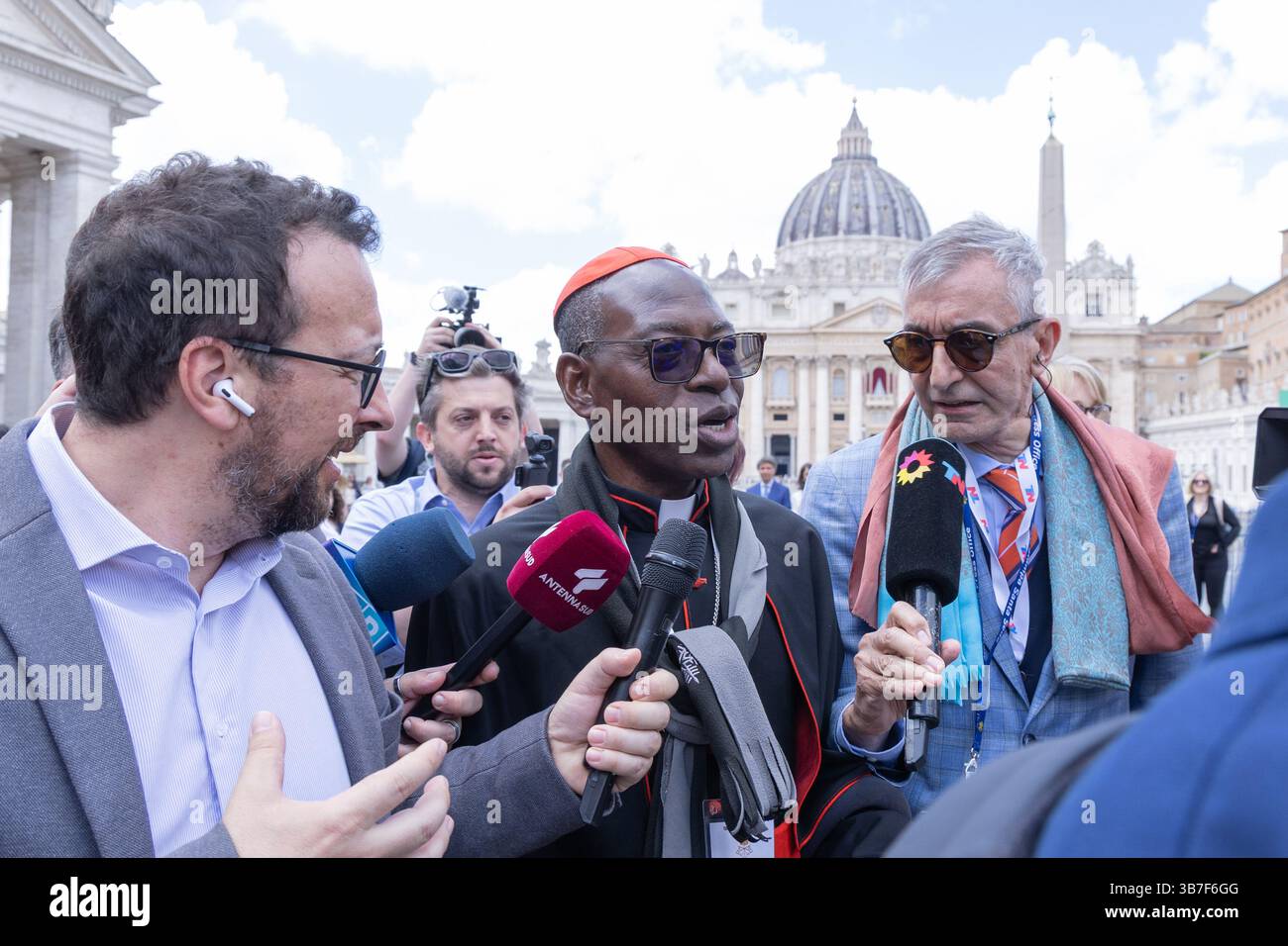 Cardinal Ignace Bessi Dogbo leaves St. Peter's Square after the twelfth ...