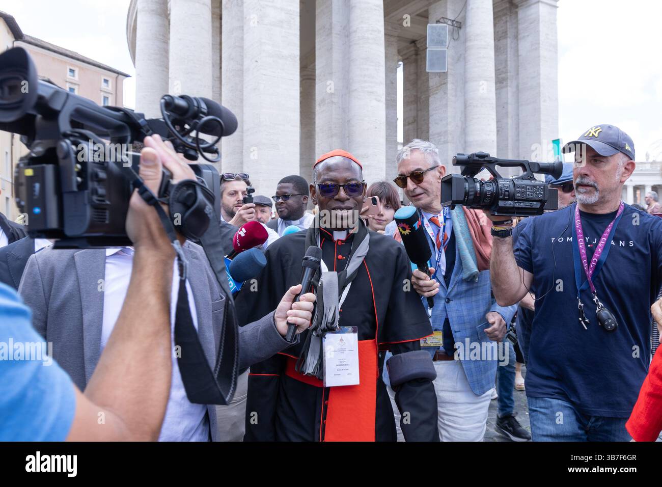 Cardinal Ignace Bessi Dogbo leaves St. Peter's Square after the twelfth ...