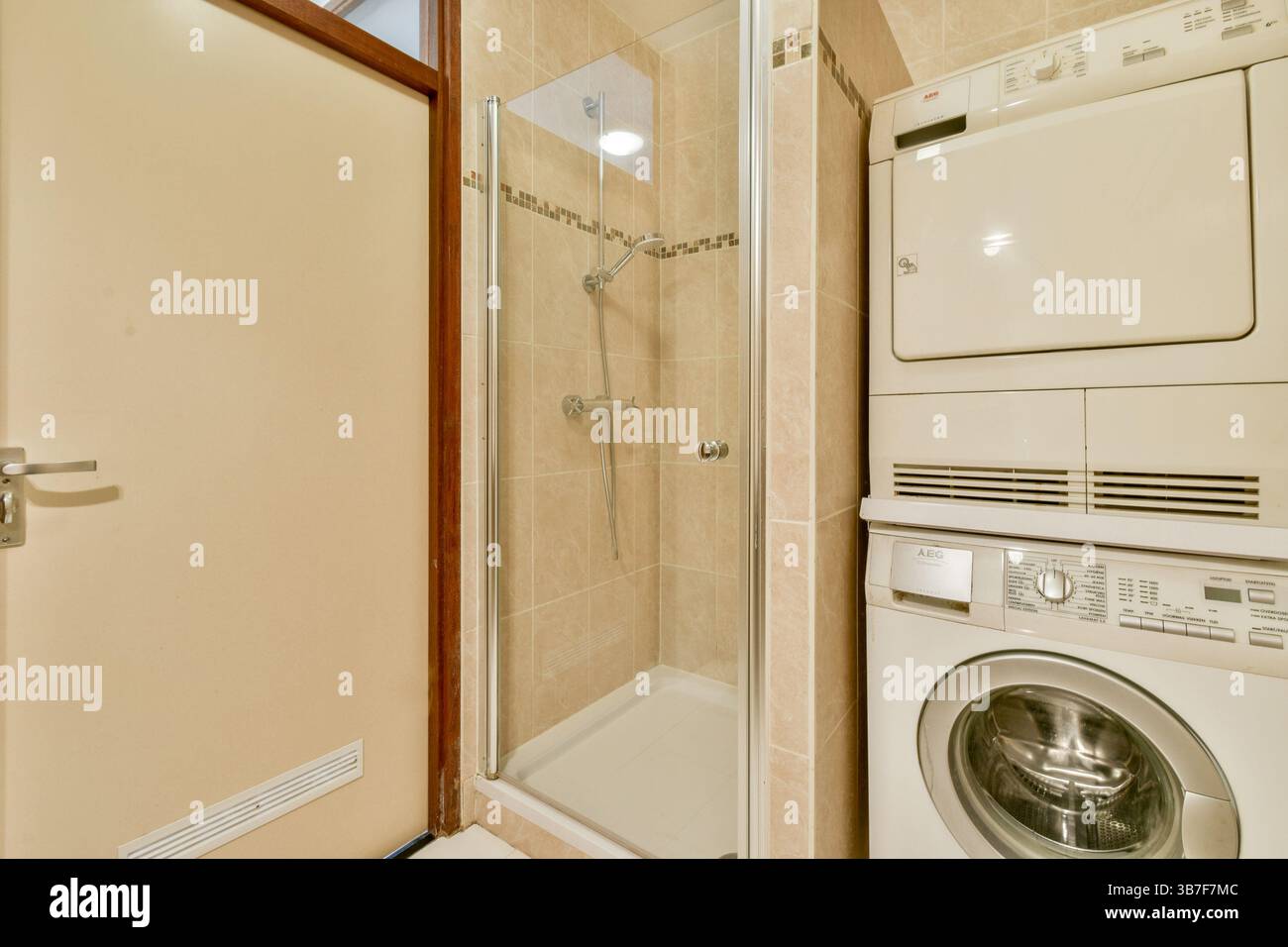 A compact and contemporary bathroom featuring a glass shower enclosure ...