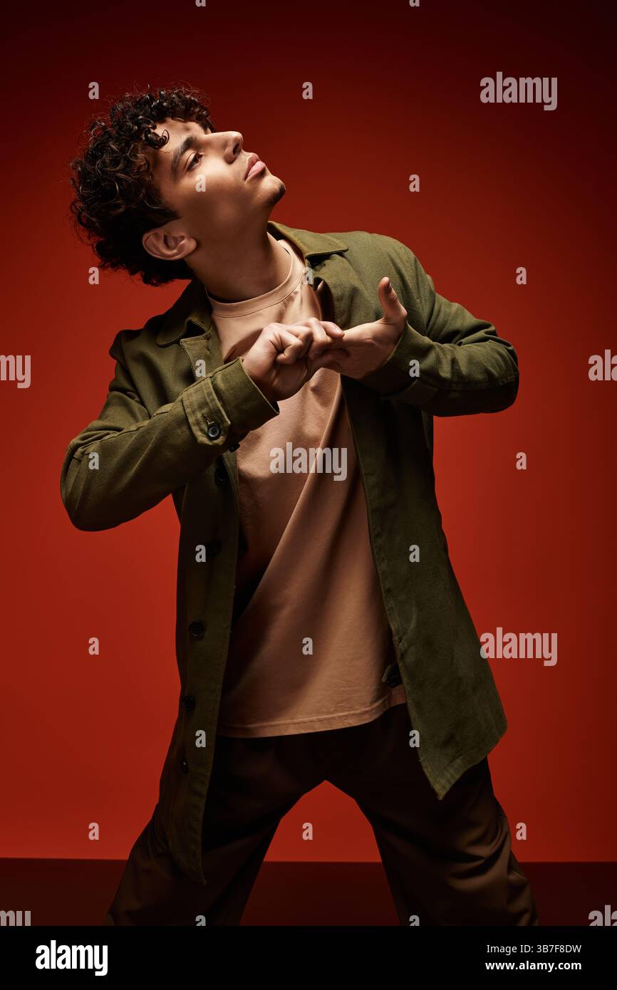 Handsome young man strikes an artistic pose, showcasing his unique ...