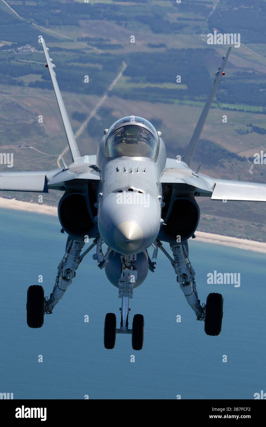 The McDonnell Douglas F/A-18 Hornet, with landing gear down, is a ...