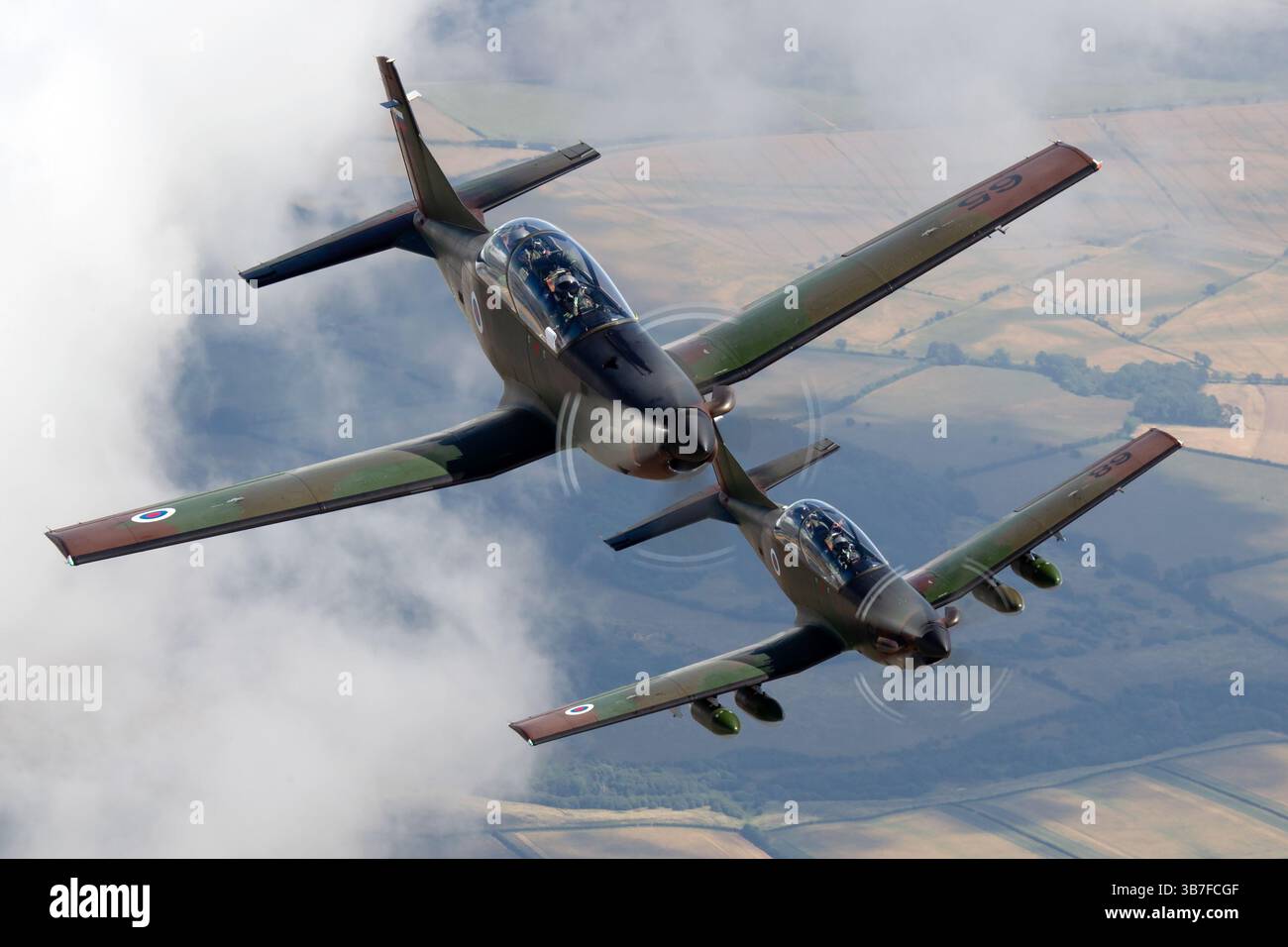 The Embraer EMB 314 Super Tucano, in formation with aircraft Reg. 65 ...