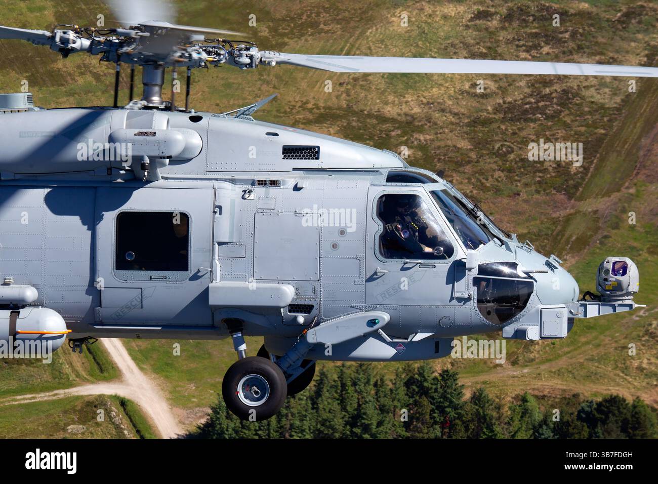 The Sikorsky MH-60R Seahawk, with registration N-977, serves as a ...
