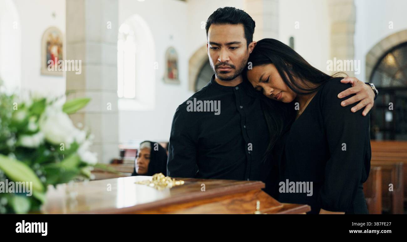 Death, comfort or couple mourning at funeral in church for respect ...