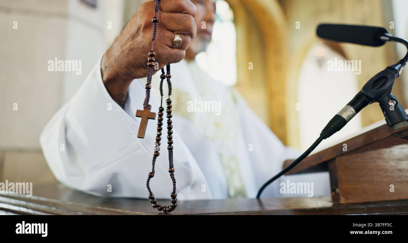 Rosary, hand and preacher praying in church as Christian for salvation ...