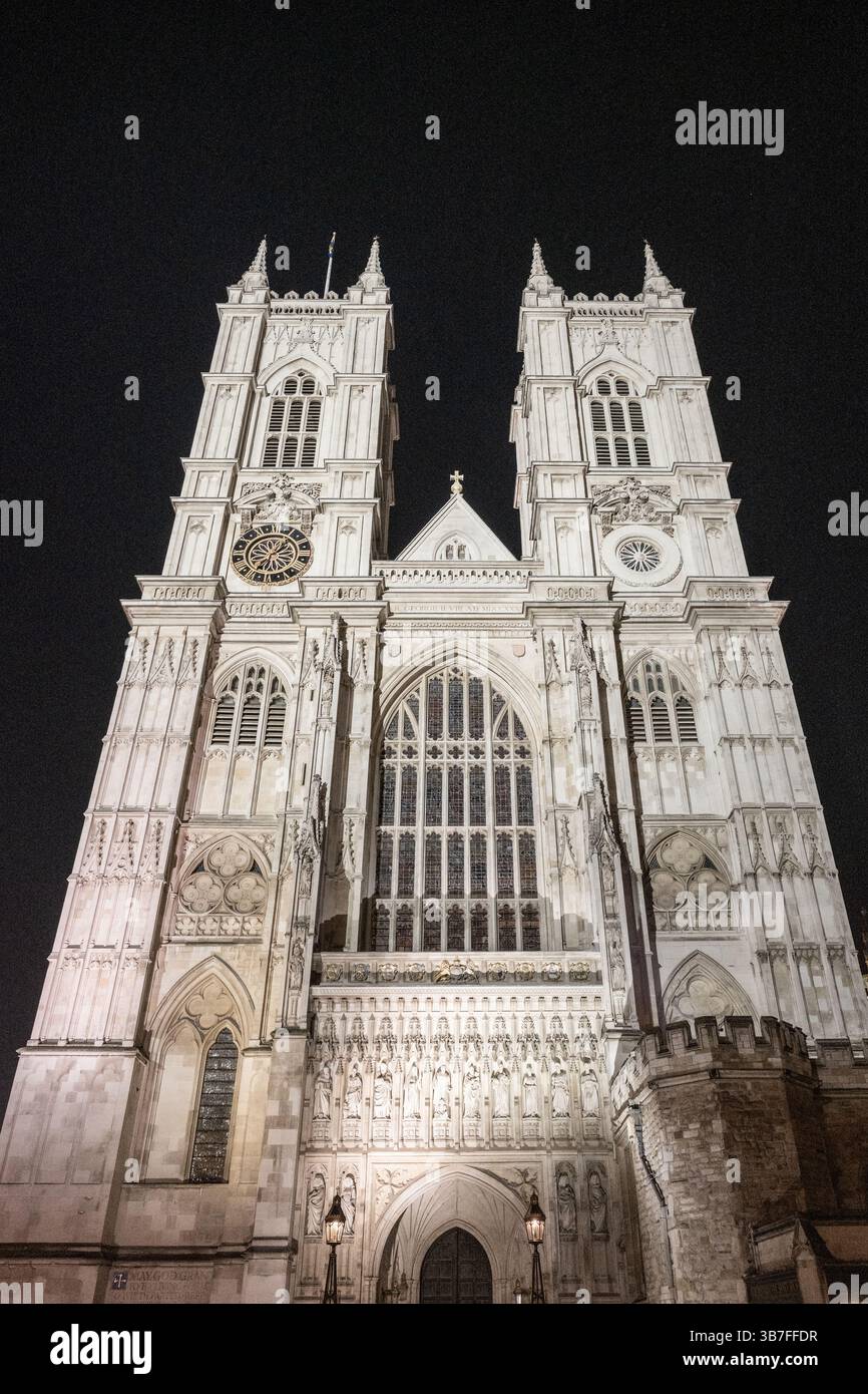 Westminster Abbey stands majestically lit against the night sky in ...