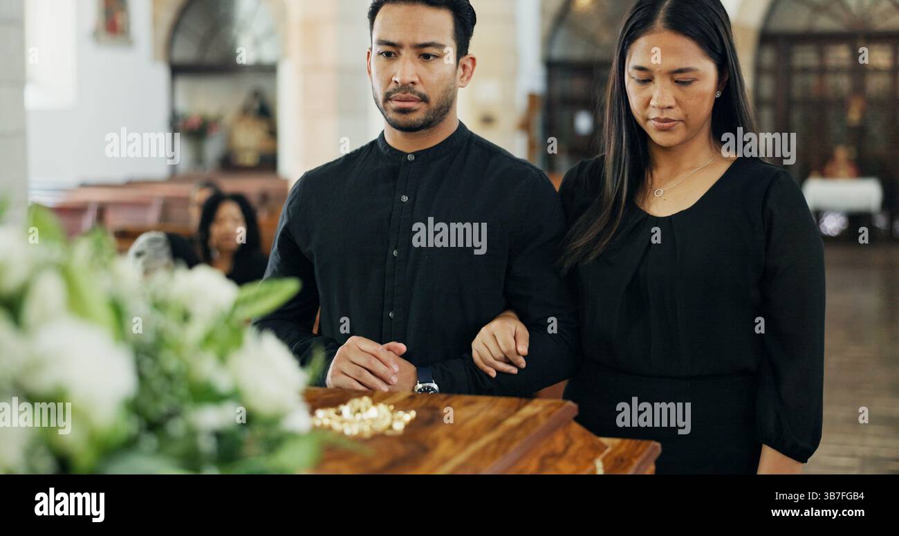 Couple, coffin and funeral in church for death, pay respect and comfort ...