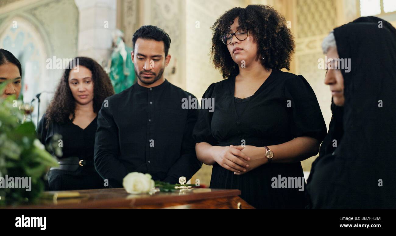 Sad, people or family with casket in funeral for farewell service, mourning death or grief ...
