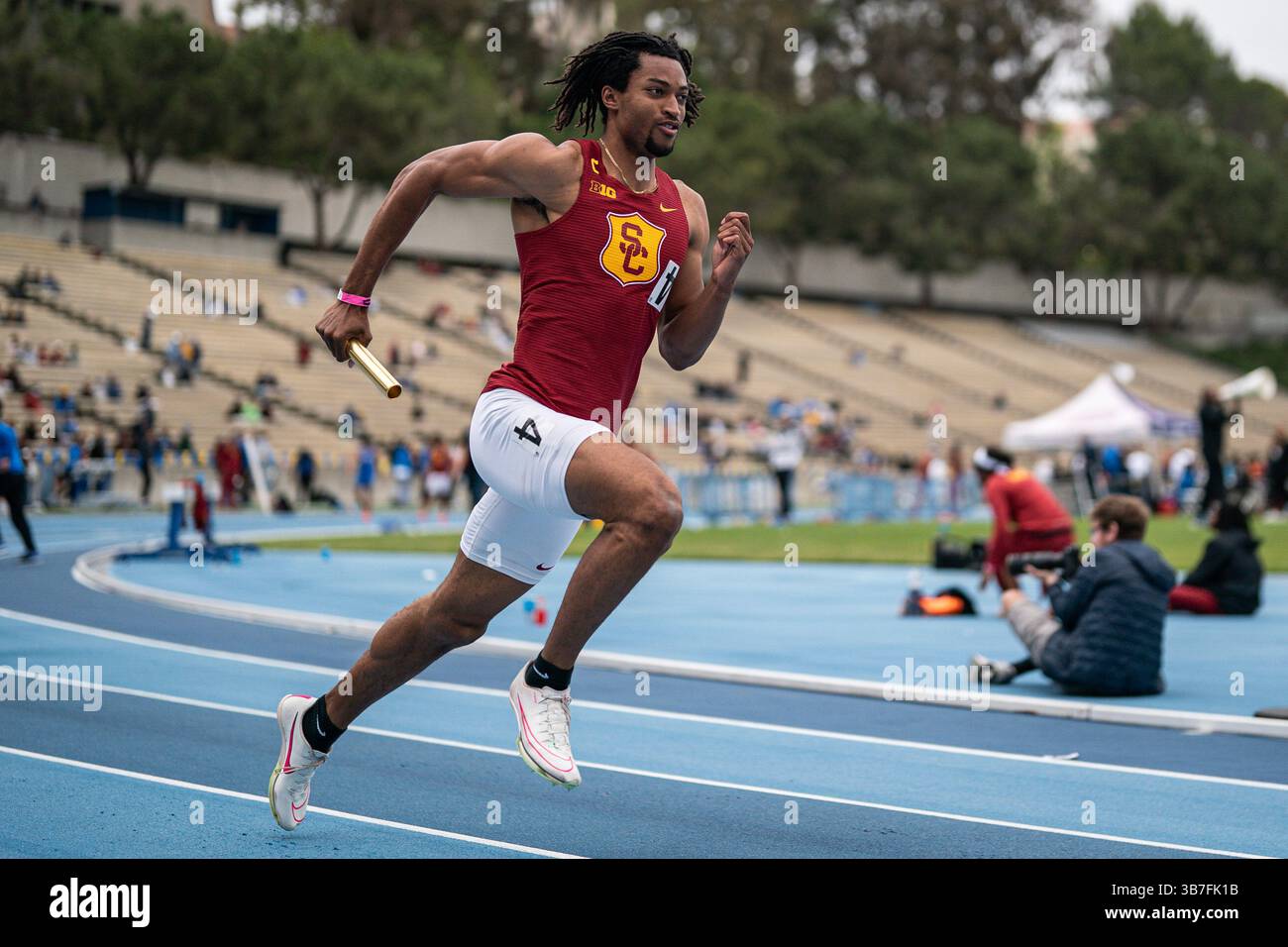 Williams Jones of the USC Trojans runs the 4 x 400 relay during a NCAA ...