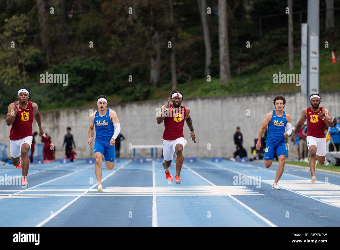 JC Stevenson of the USC Trojans (middle) wins the 100 meters during a ...
