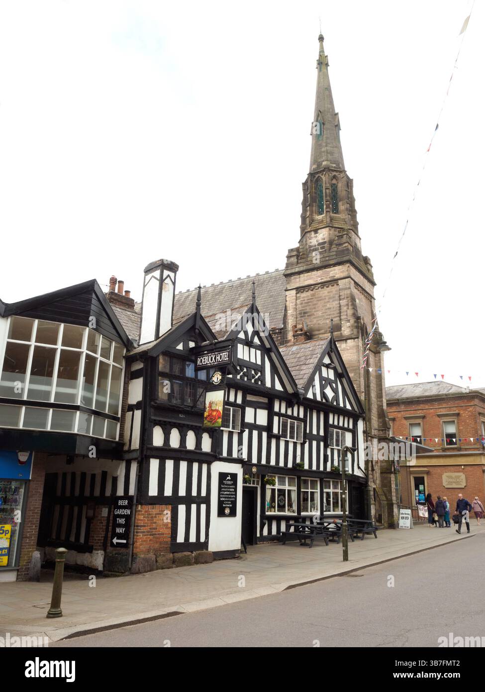 Derby Street Leek, The Roebuck Hotel and Trinity Church Stock Photo - Alamy