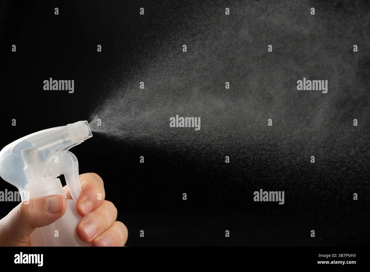 Cleaning surface with water spray macro close up view Stock Photo - Alamy