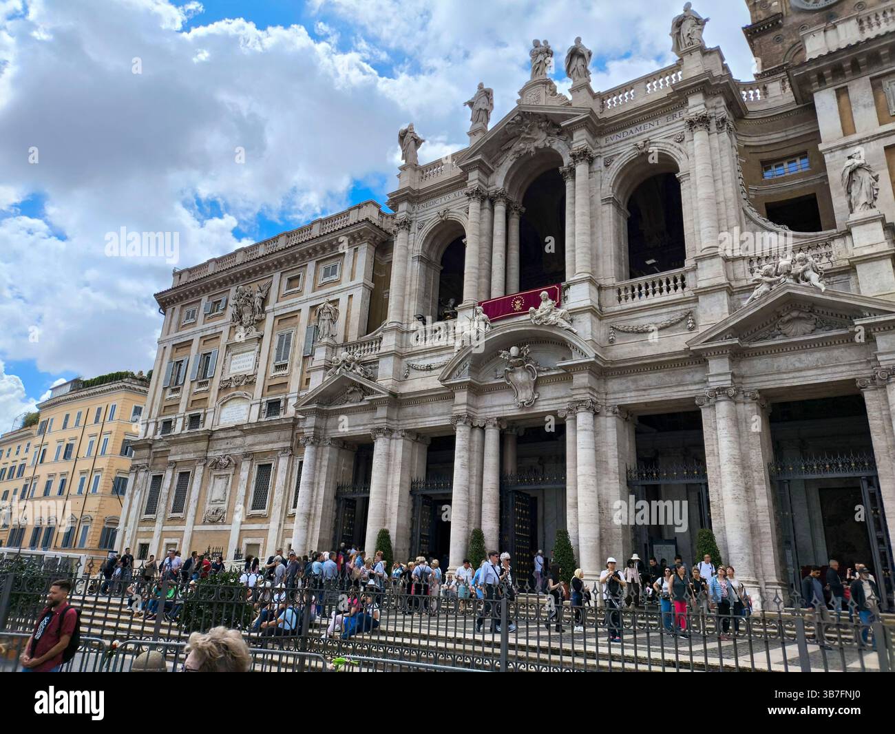 People queue to visit the Basilica of Santa Maria Maggiore which houses ...