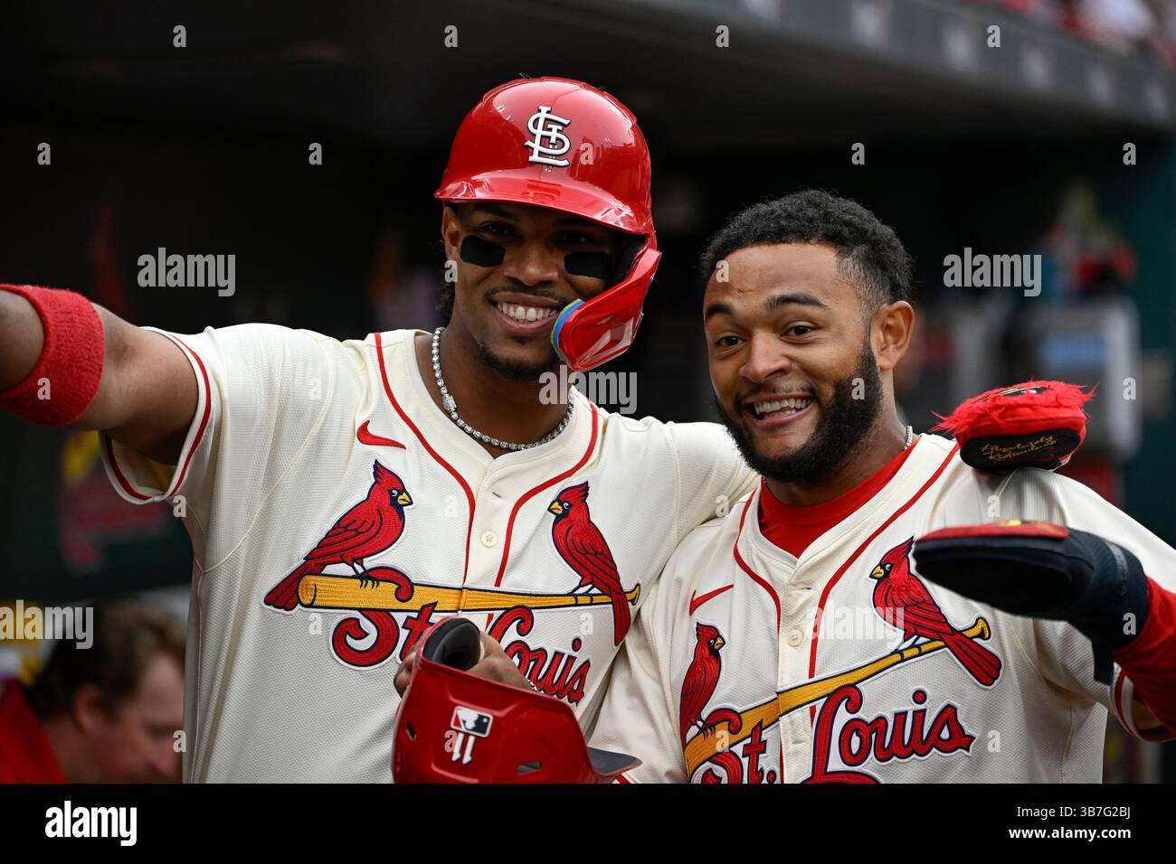 St. Louis Cardinals' Jose Barrero, left, and Victor Scott II, right ...
