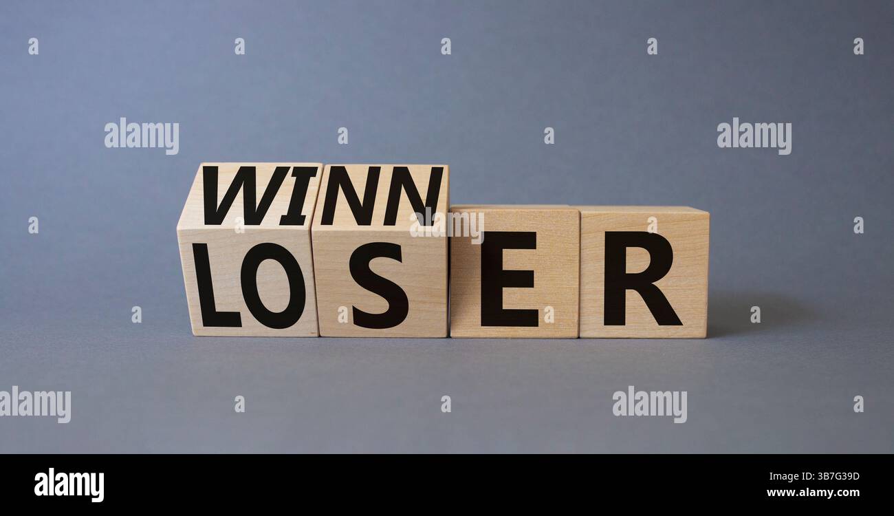 Winner and Loser symbol. Turned wooden cubes with words Winner and ...