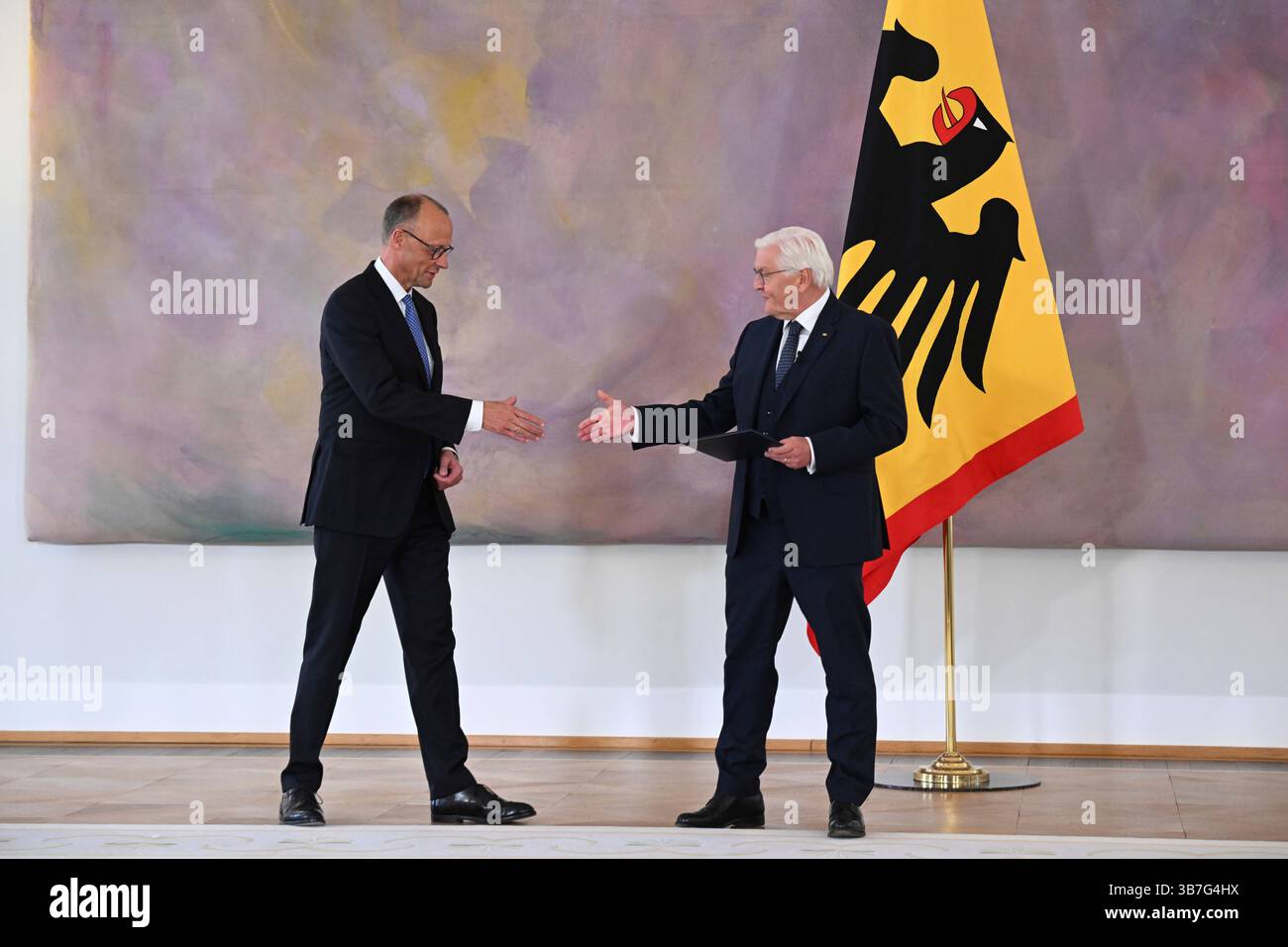 German President Frank-Walter Steinmeier, right, presents Federal ...