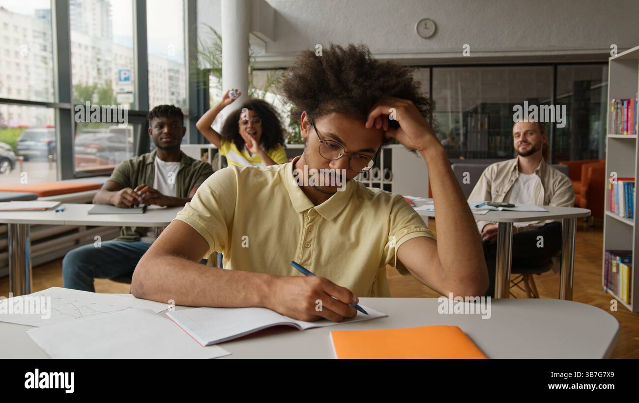 African American man student guy writing task in class lesson in ...