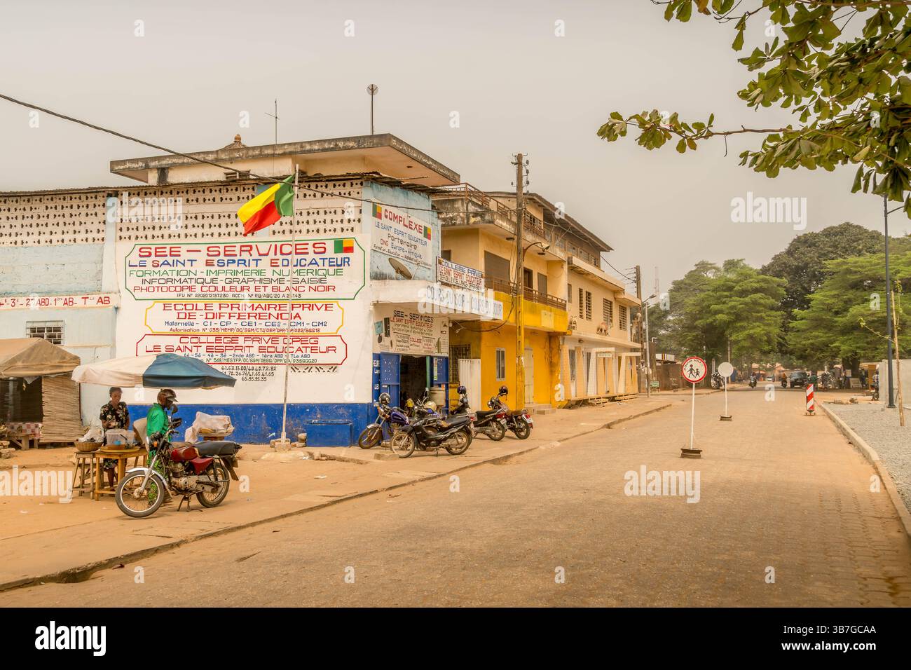 Flag of Benin on the streets of Beninese city of Ouidah in West Africa ...