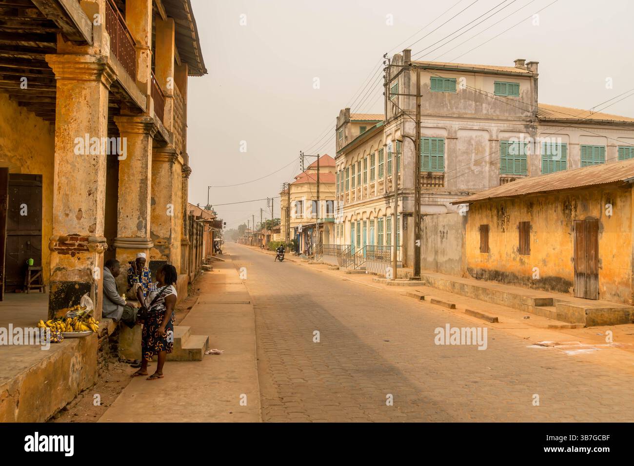 Colonial architecture in Ouidah, Benin, West Africa, with locals ...