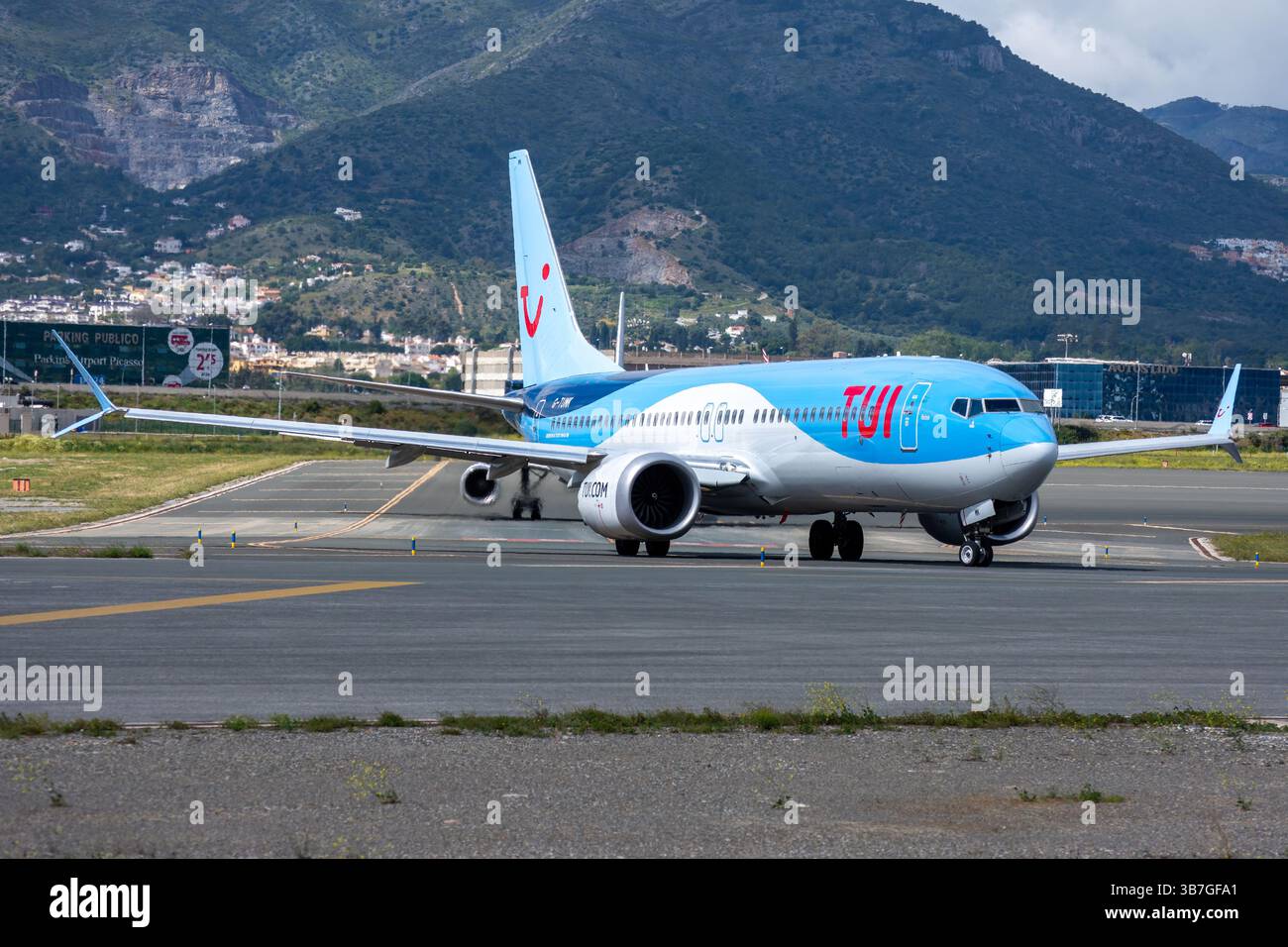 A modern TUI Airways Boeing 737 MAX airliner taxiing for takeoff at ...