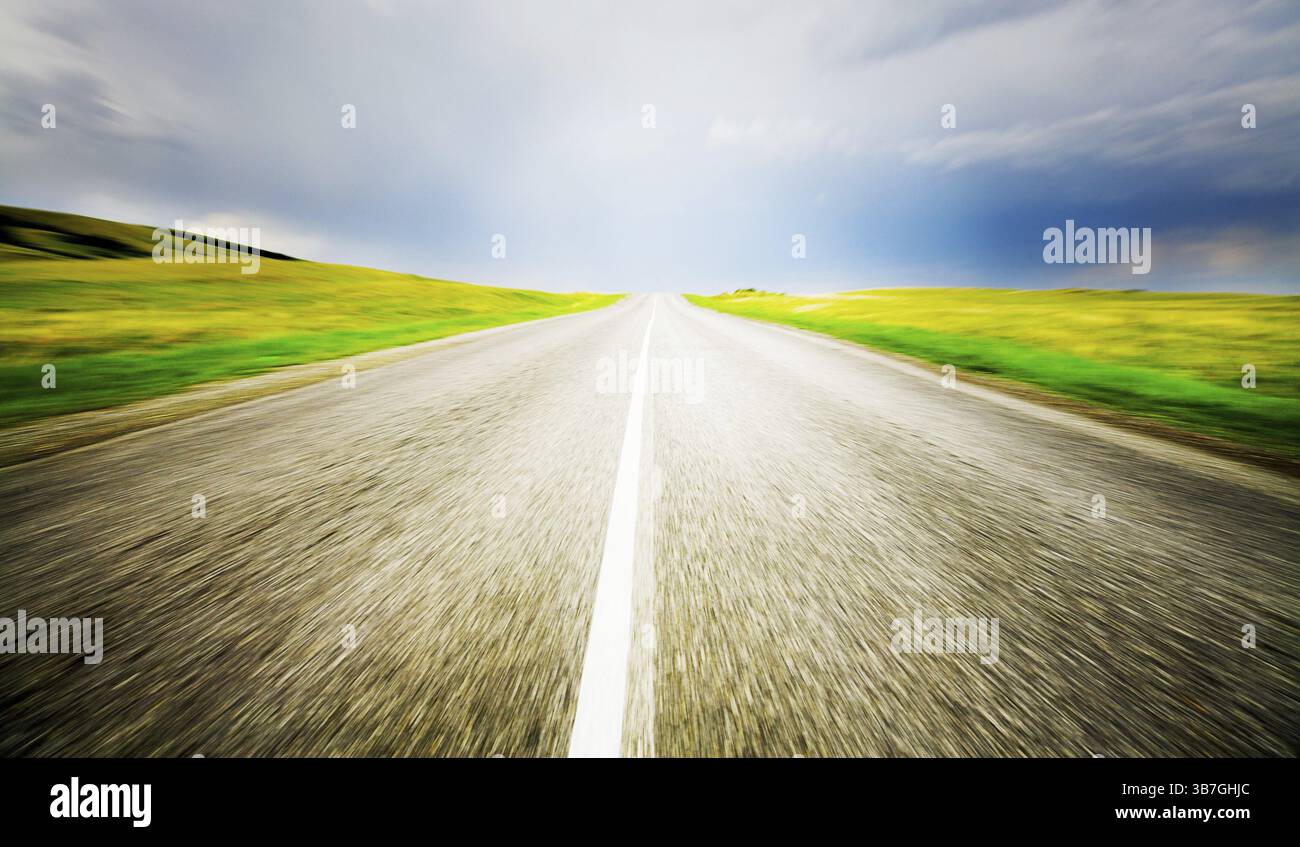 High speed road with cloudy sky background Stock Photo - Alamy