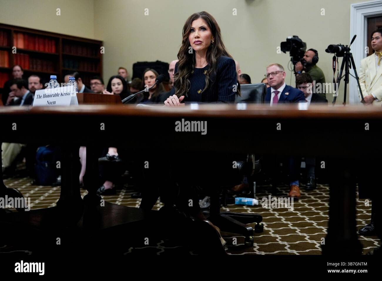 Homeland Security Secretary Kristi Noem listens to members speak during ...
