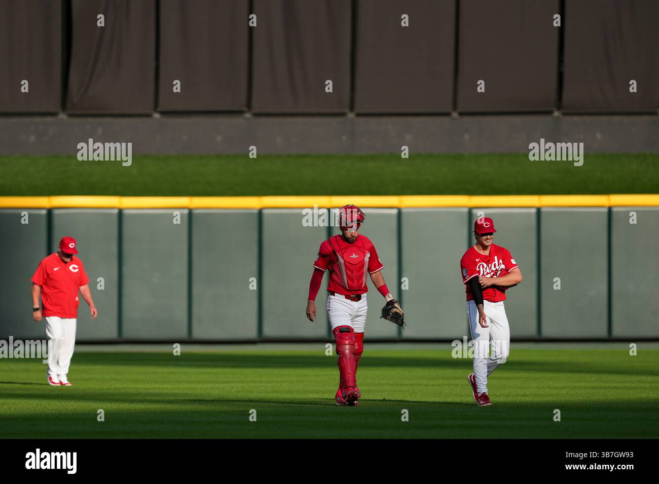 Cincinnati Reds pitcher Chase Petty, right, walks to the dugout with ...