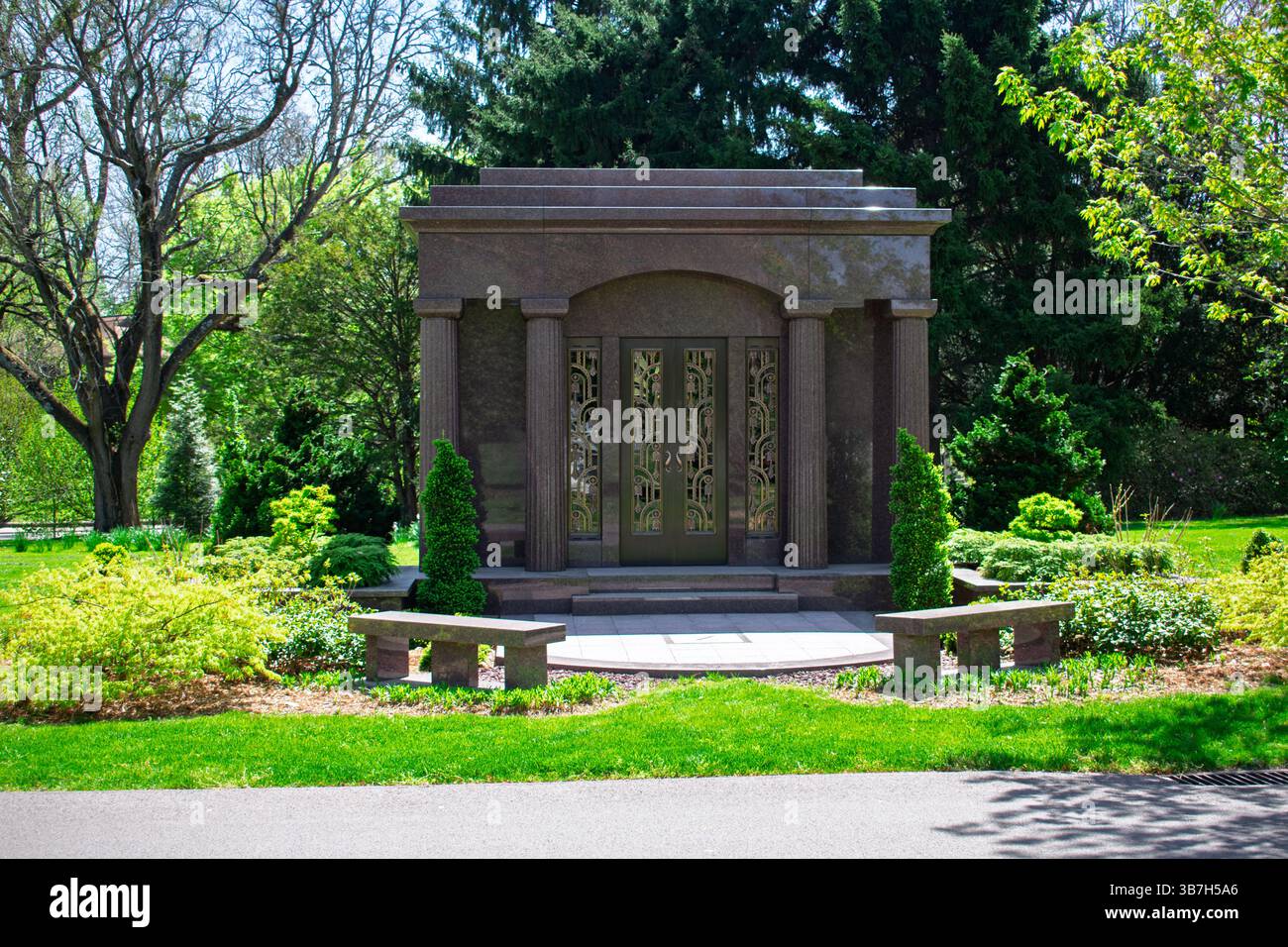 Dark brown stone crypt with benches Stock Photo - Alamy