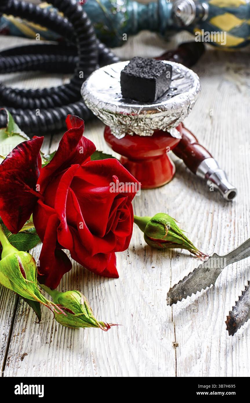 Smoking Turkish hookah filled with tobacco with the taste of roses ...
