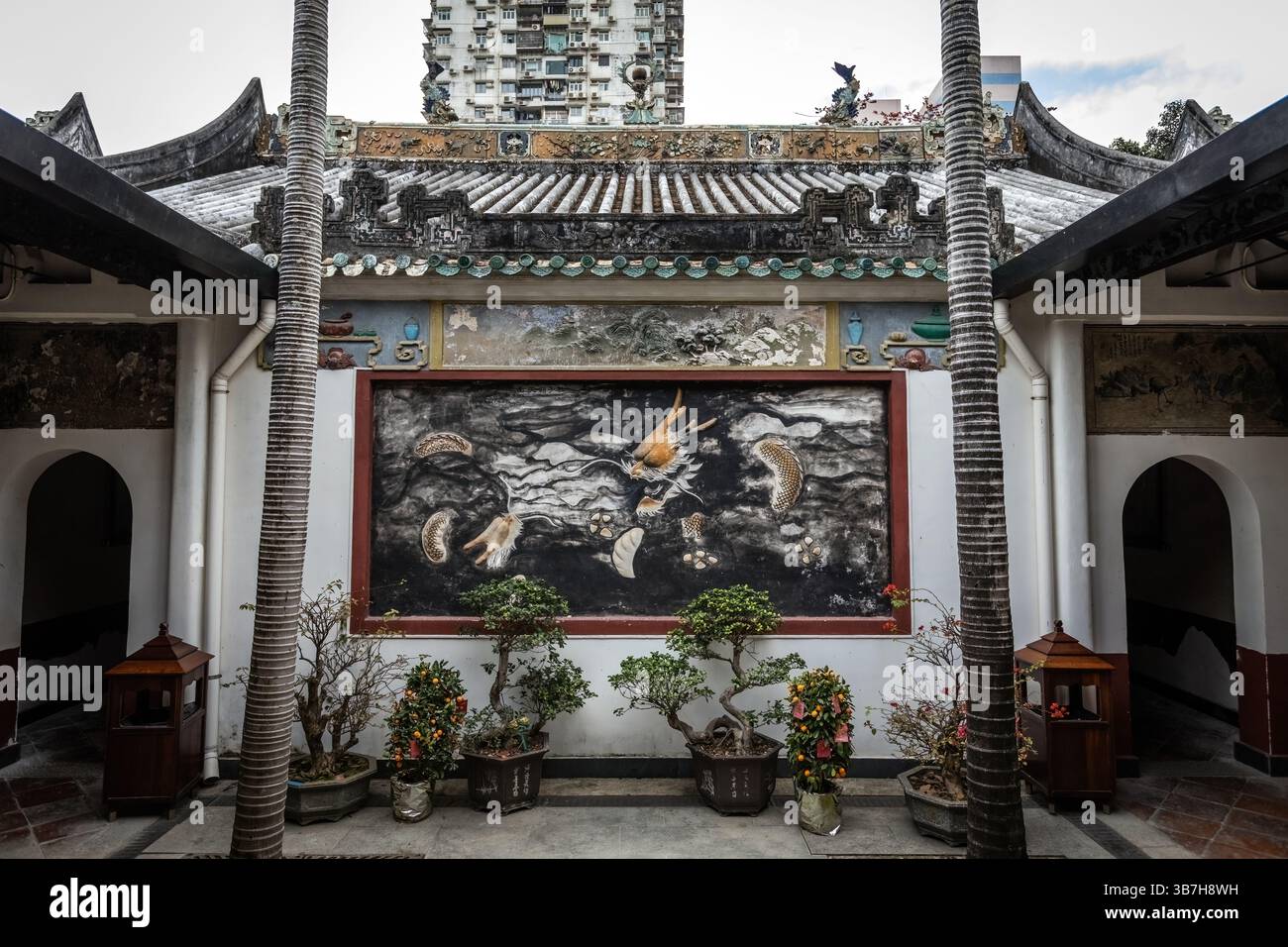 Traditional Chinese mural with koi fish and wave motifs, framed by ...
