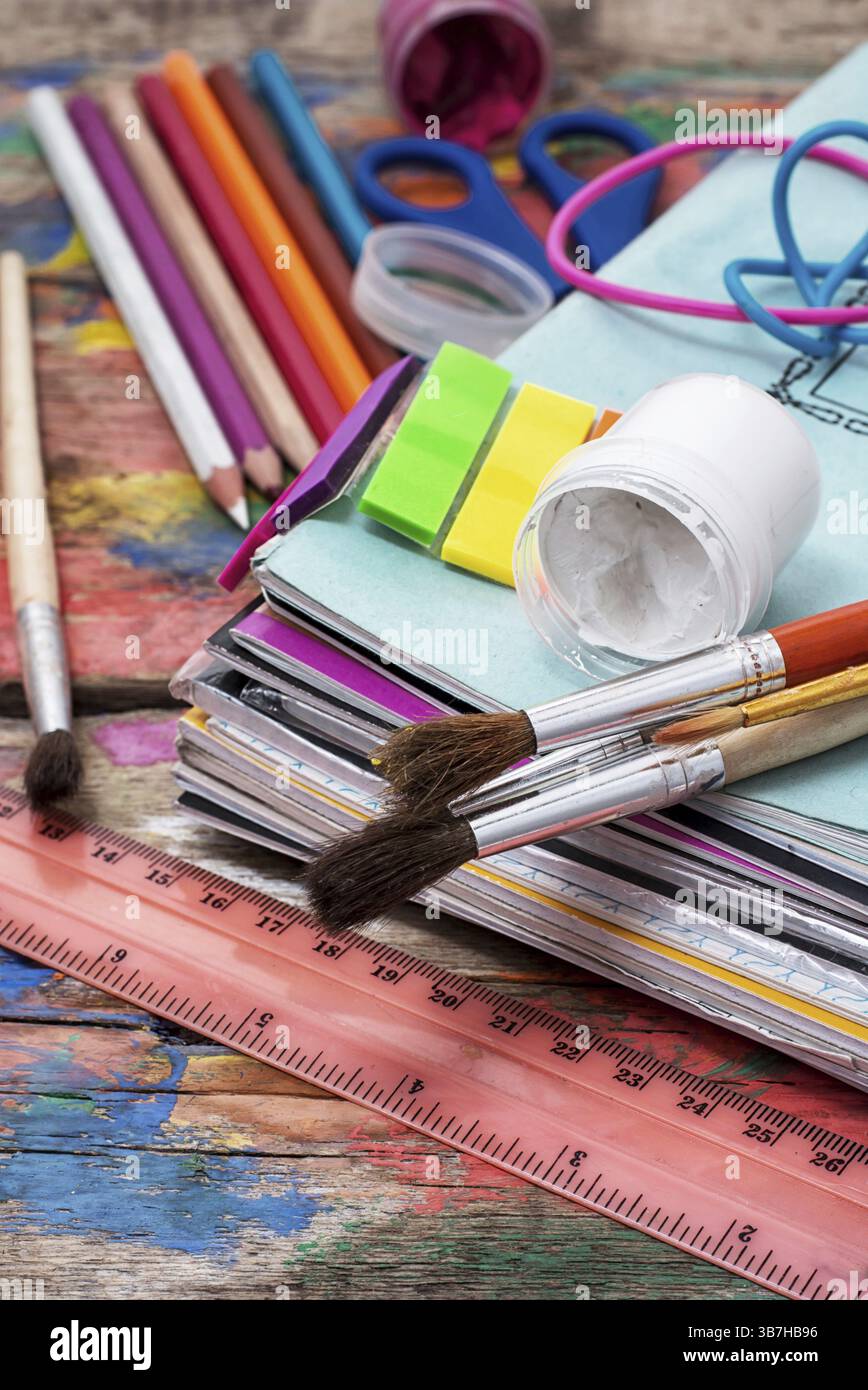 Pen and notebook tool a first grader to school Stock Photo - Alamy