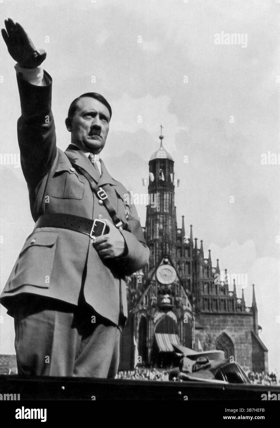 Adolf Hitler giving the Nazi salute from a Mercedes with the ...