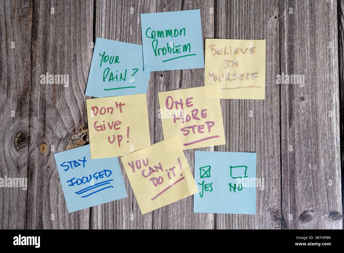 Colorful sticky notes with uplifting messages offer encouragement and ...