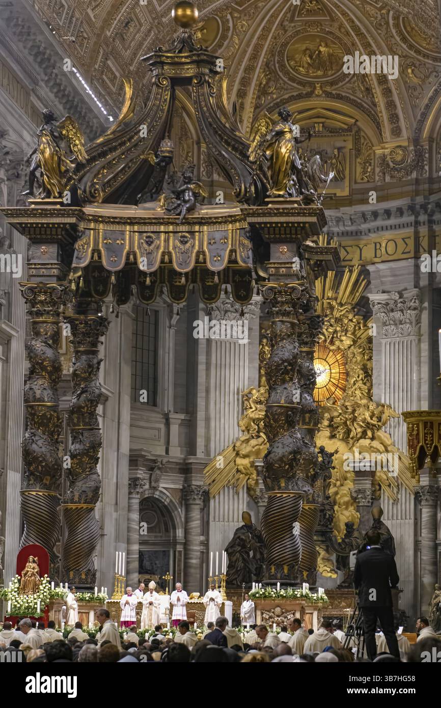 Saint Father Pope Francis with mitre prays in St Peter's Basilica under canopy of Bernini holds ...