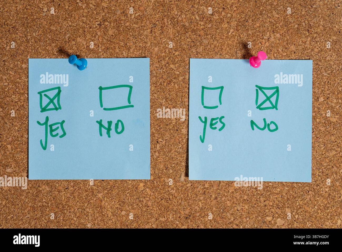 Two opposite choices pinned to cork board, making a decision Stock ...