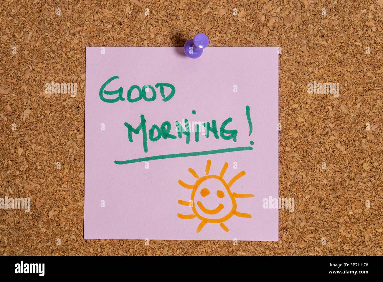 Pink sticky note wishing good morning on cork board Stock Photo - Alamy