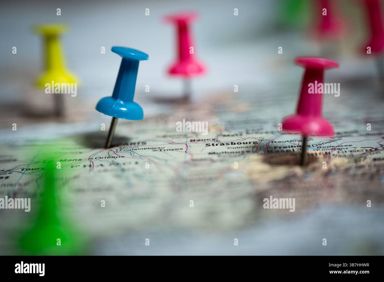 Colorful push pins marking locations on map of france, showing travel ...