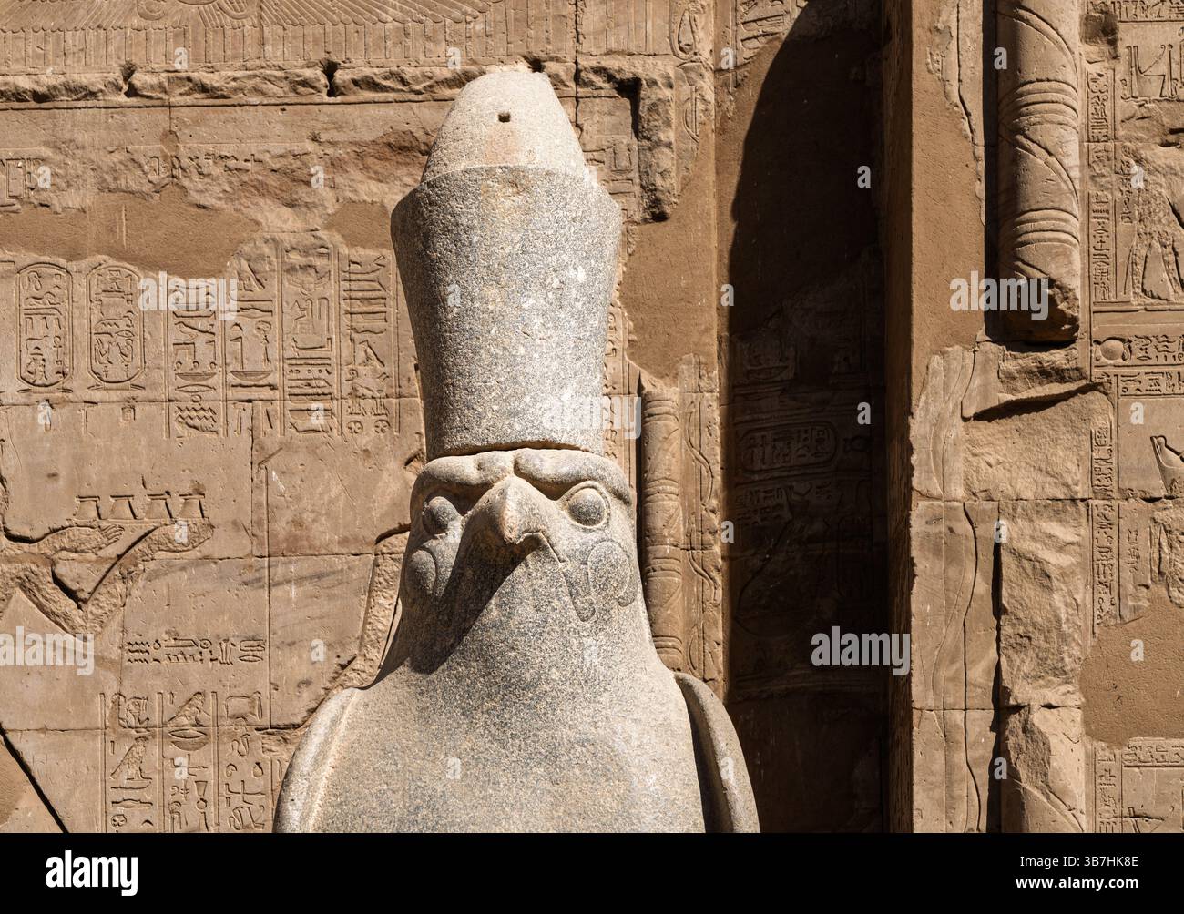 Detail of the carved statue of Horus outside the Pylon at the entrance ...