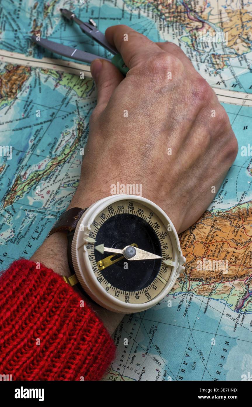 Hand to indicate the route on topographic map Stock Photo - Alamy