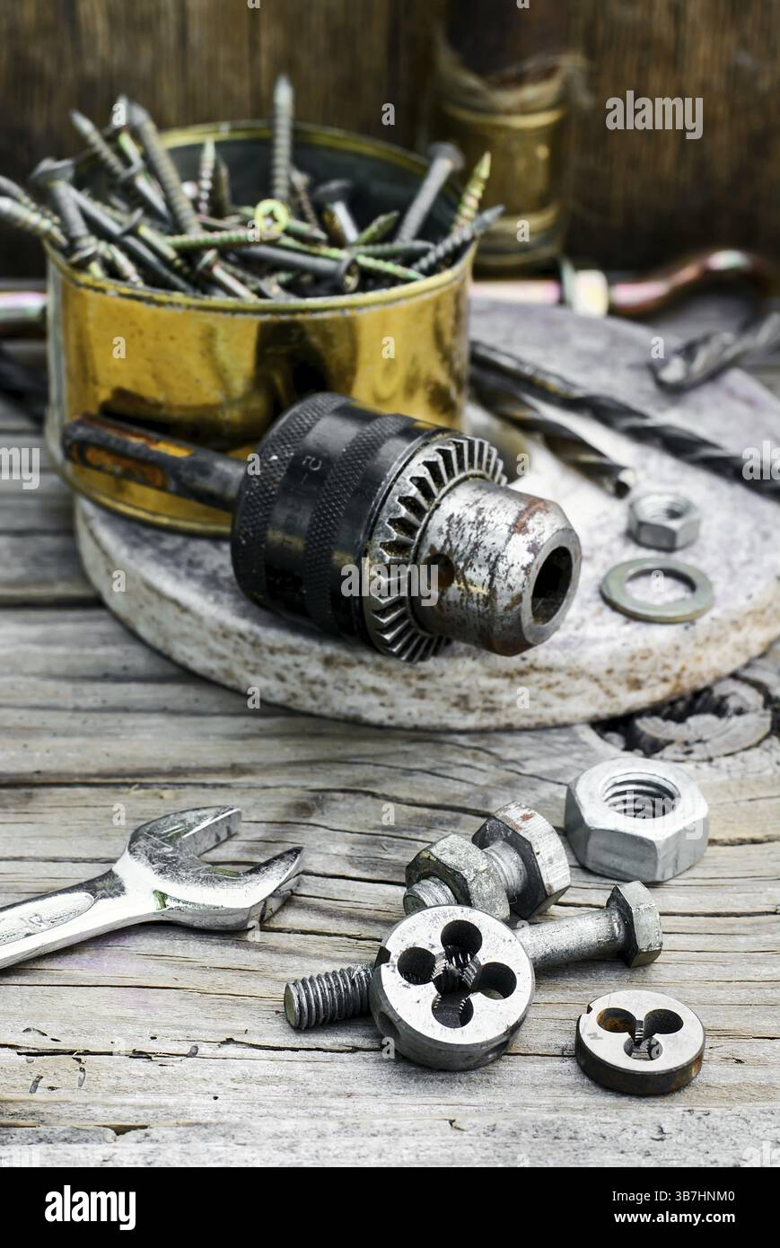 Set of nuts, bolts, springs and dies for threading Stock Photo - Alamy