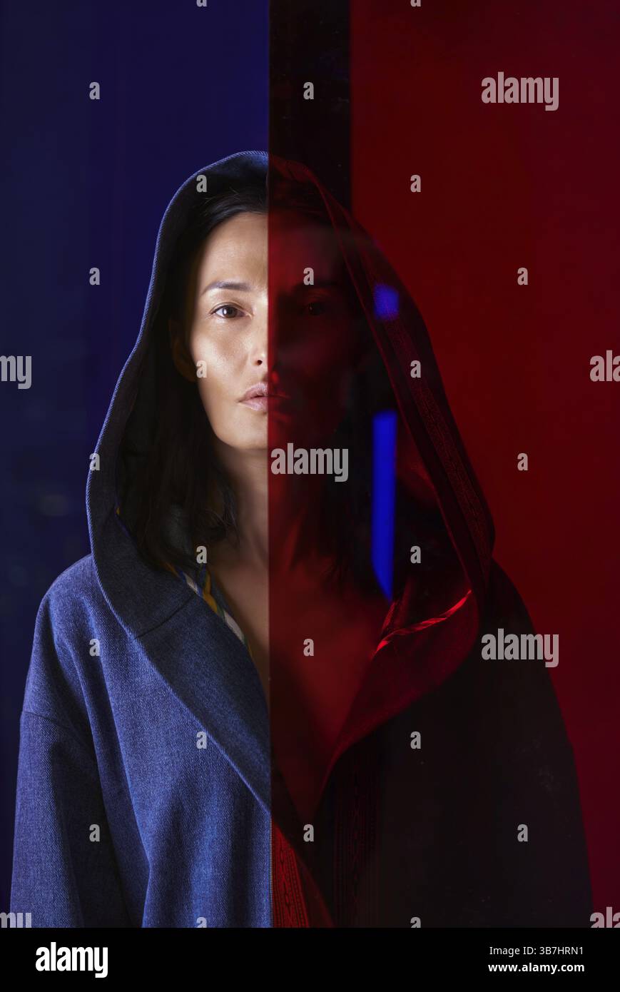 Woman In Colorful Traditional Asian Patchwork Robe Standing Behind The
