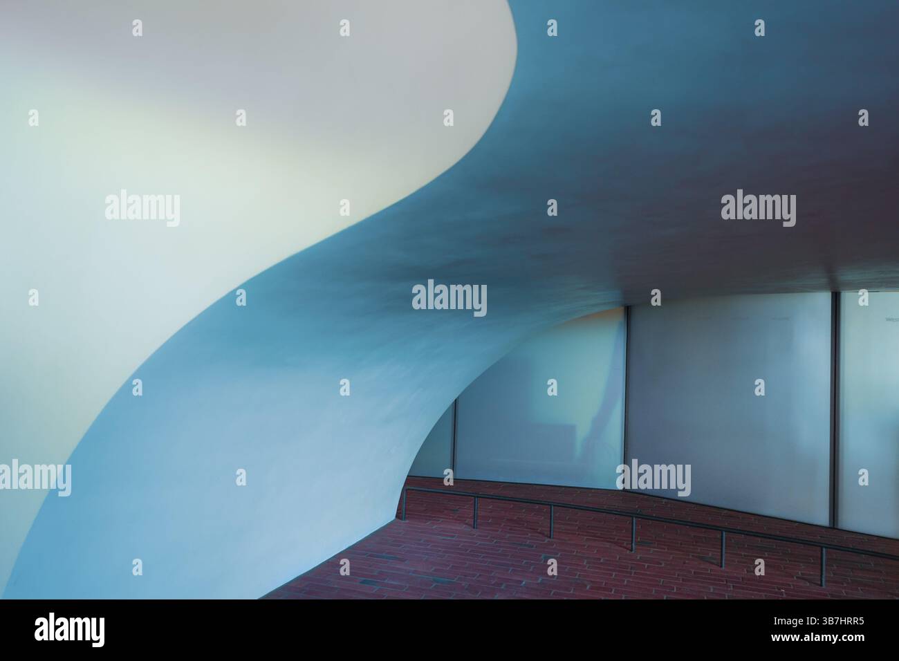 Minimalist wave-shaped ceiling with blue and white colour tones ...