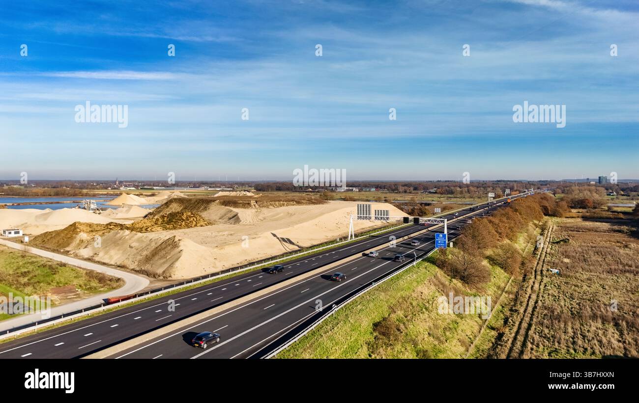 Industrial landscape with highway and cars traffic aerial drone view ...