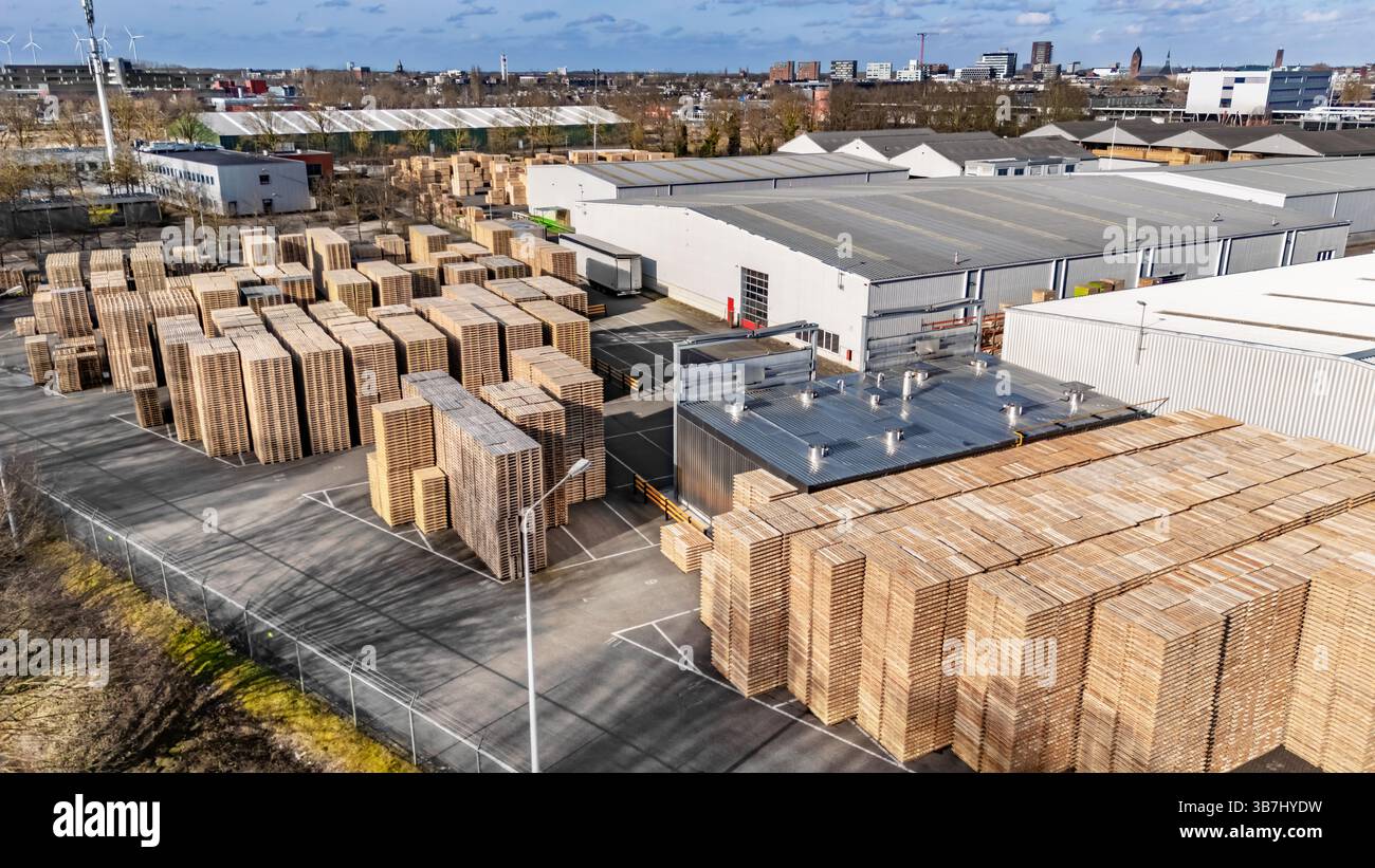 Industrial warehouse outdoors, aerial drone view of stacks of pallets ...