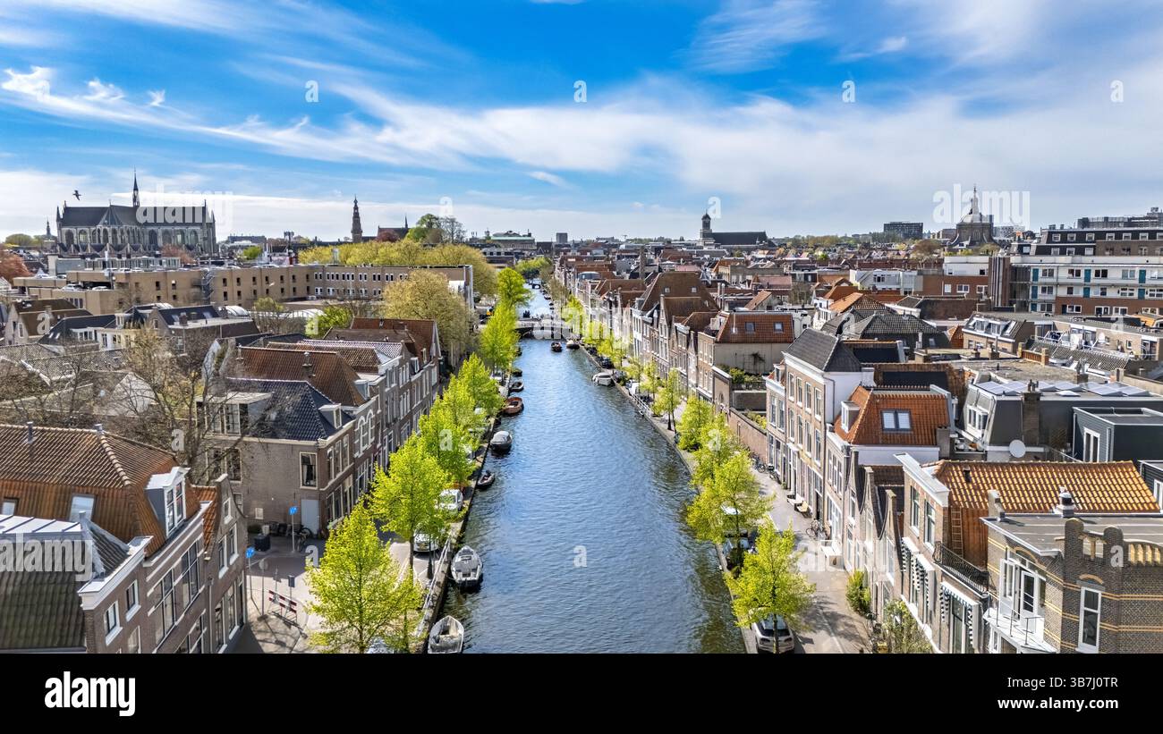 Leiden town aerial drone view from above, typical Dutch city skyline with canals and houses ...