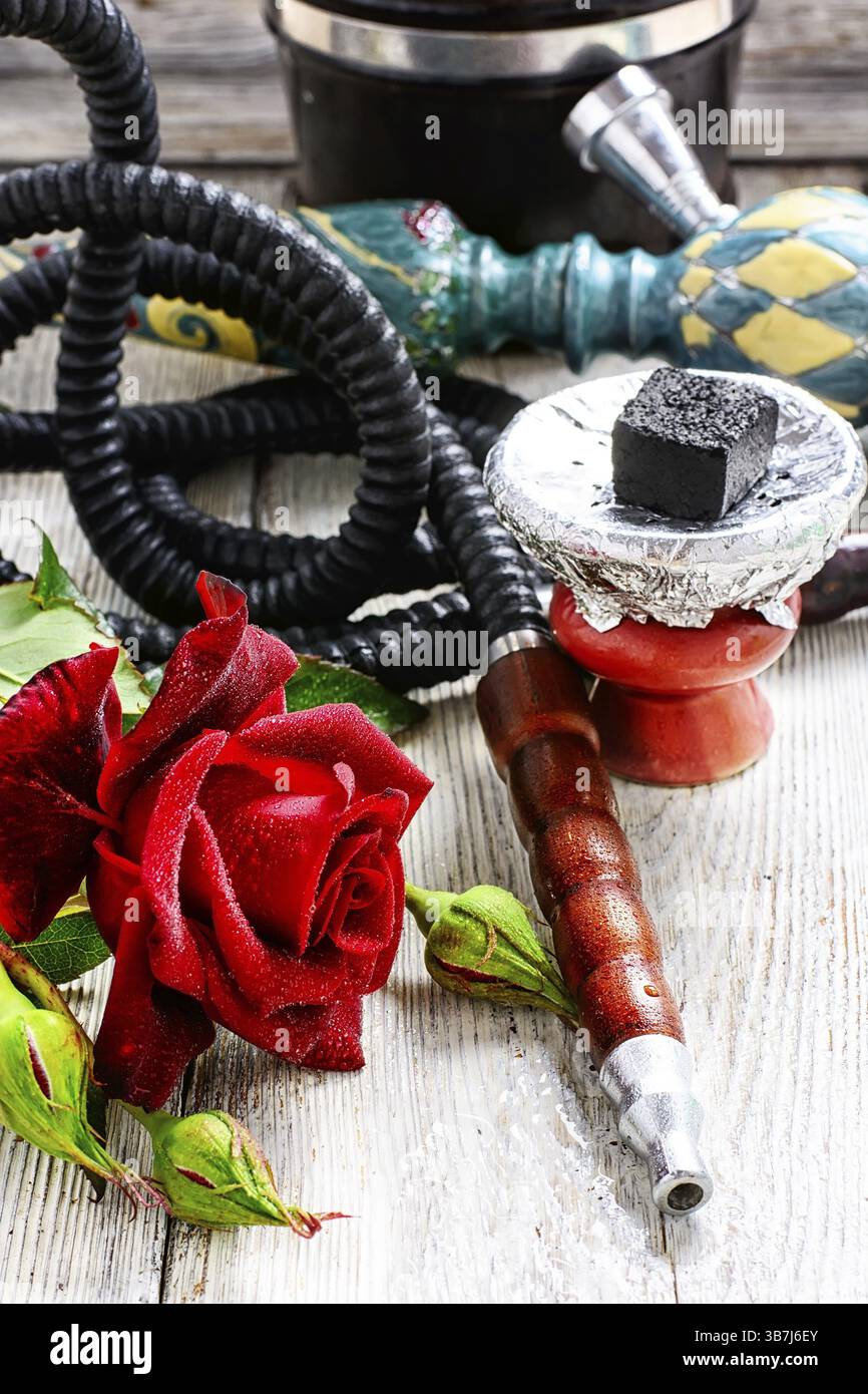 Smoking Turkish hookah filled with tobacco with the taste of roses ...