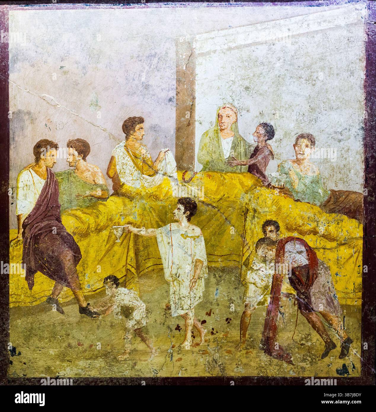 A dinner party in a wall painting from Pompeii: a small slave in a ...