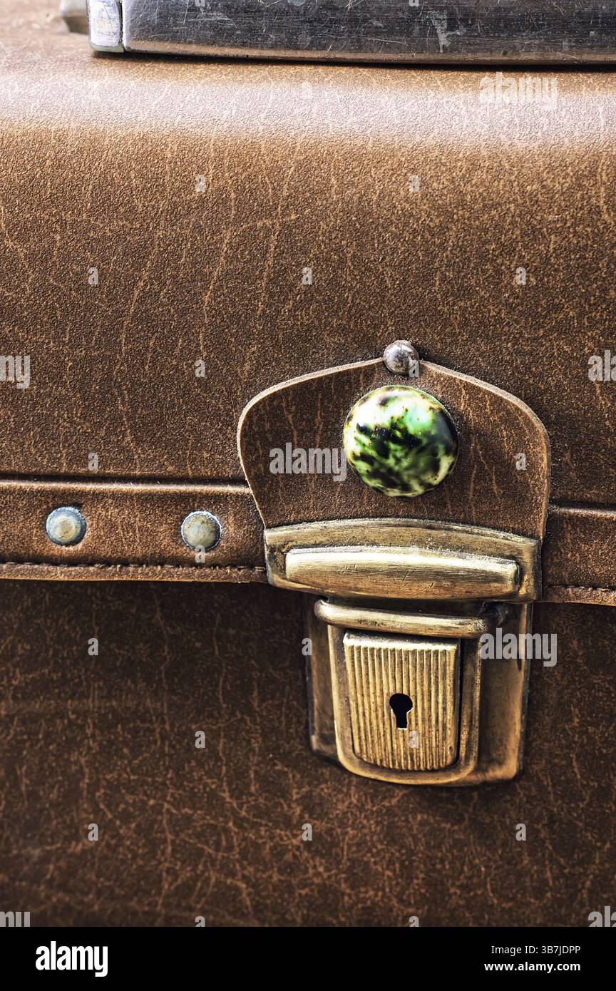 Old-fashioned suitcase in yellow leather with metal latch Stock Photo ...