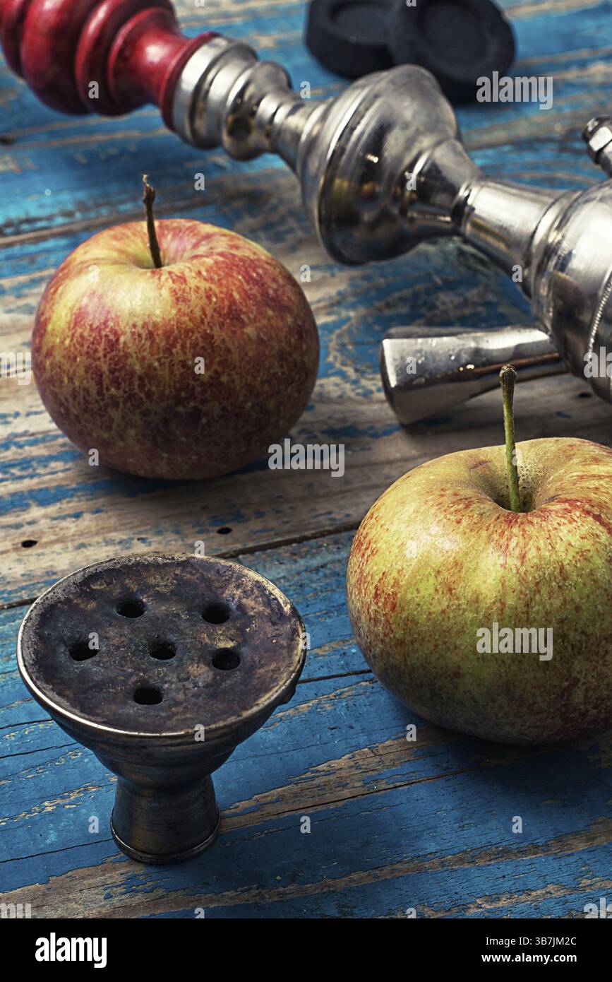 Details Shisha and accessories on wooden background.image is tinted in ...